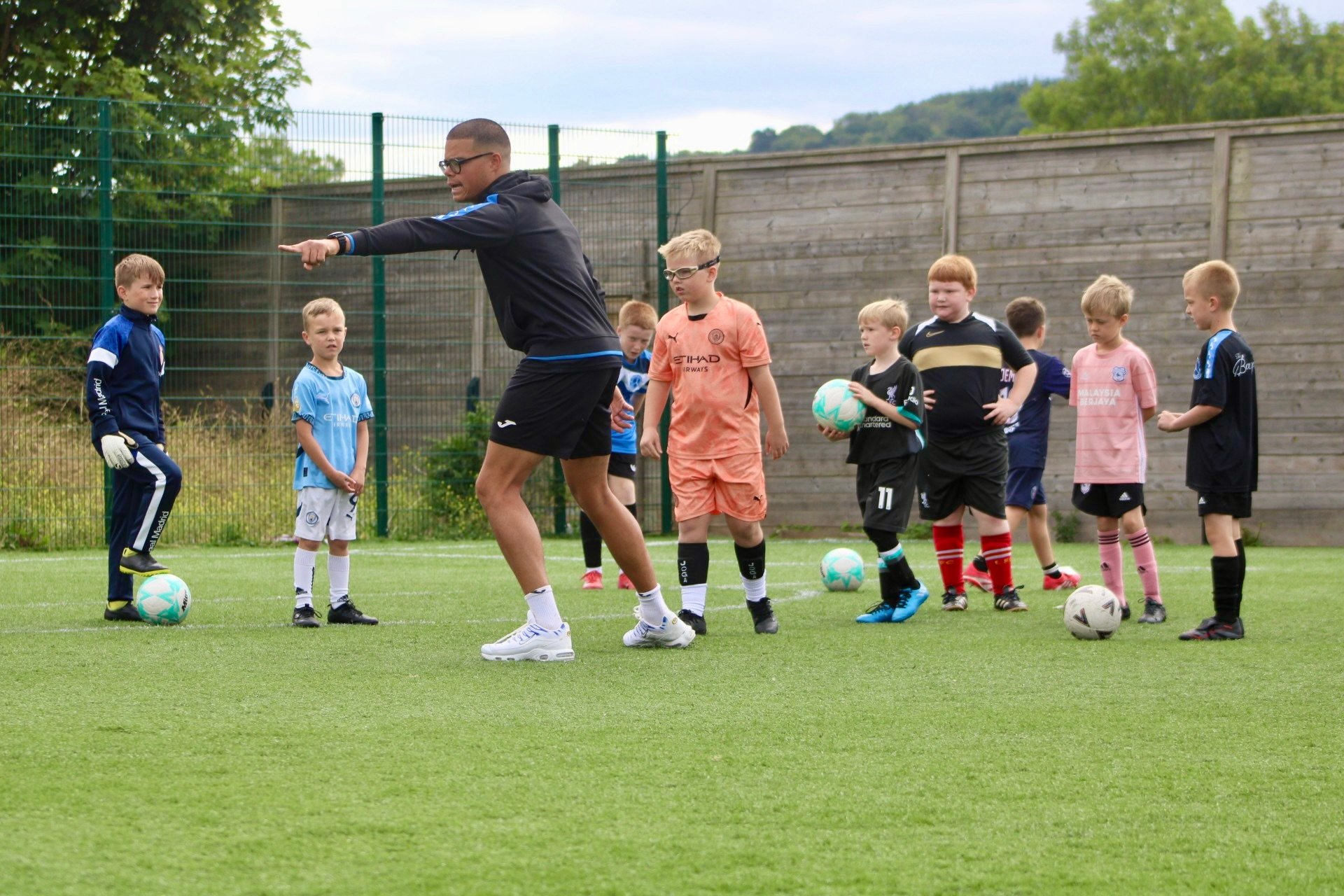 Kids get a big kick out of award-winning summer football camp ...