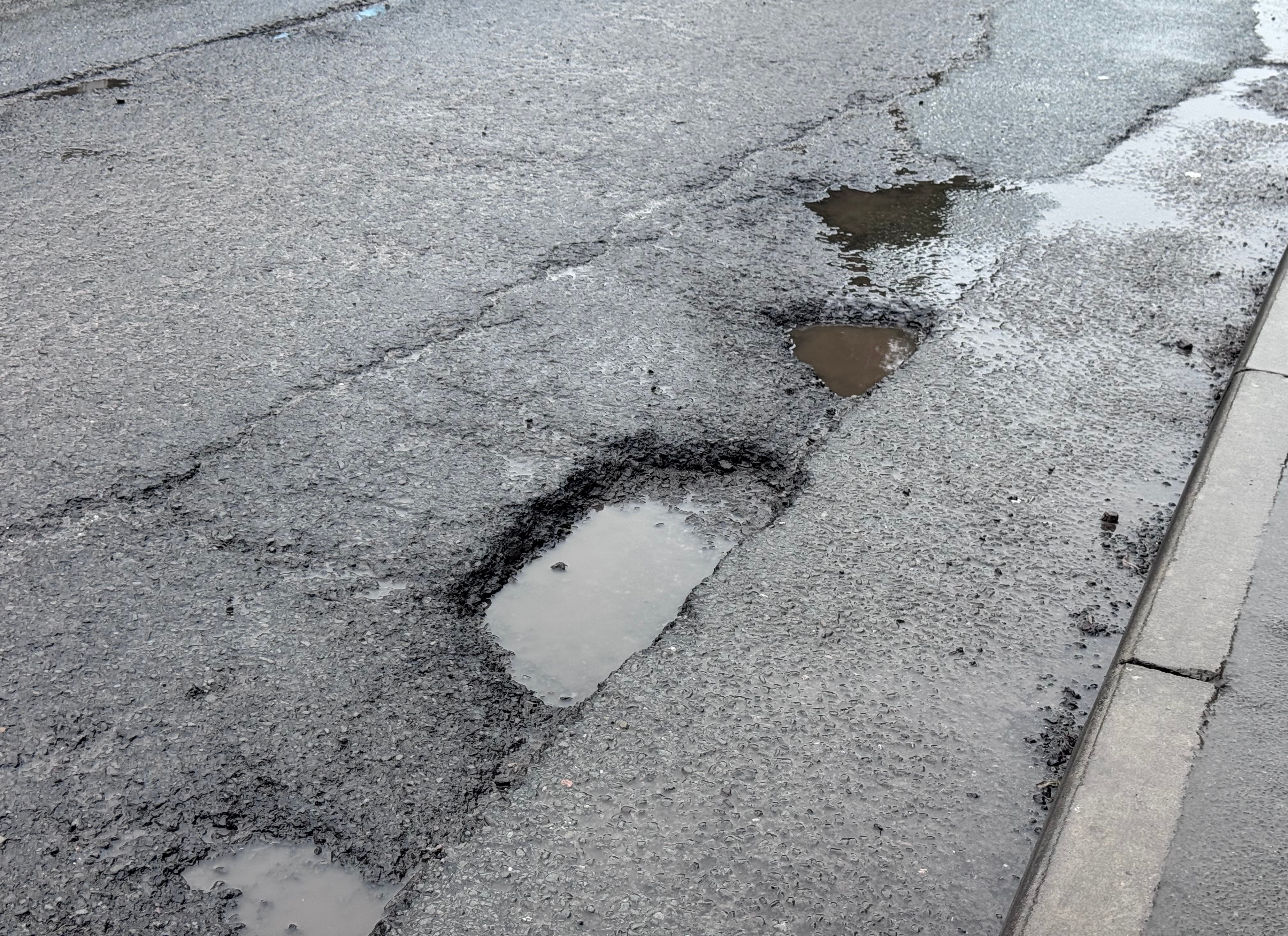 'Minefield' roads causing mayhem for motorists as council criticised ...